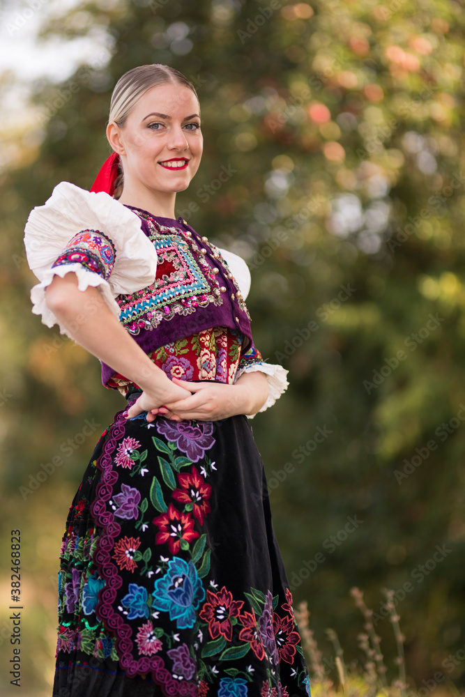 Young beautiful slovak woman in traditional costume. Slovak folklore ...