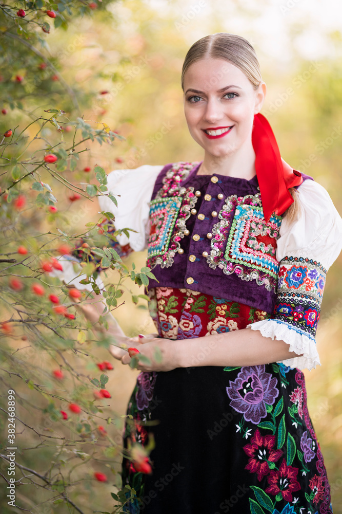 Young beautiful slovak woman in traditional costume. Slovak folklore ...
