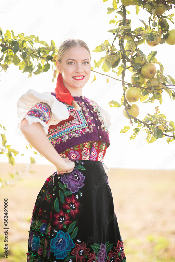 Young beautiful slovak woman in traditional costume. Slovak folklore ...