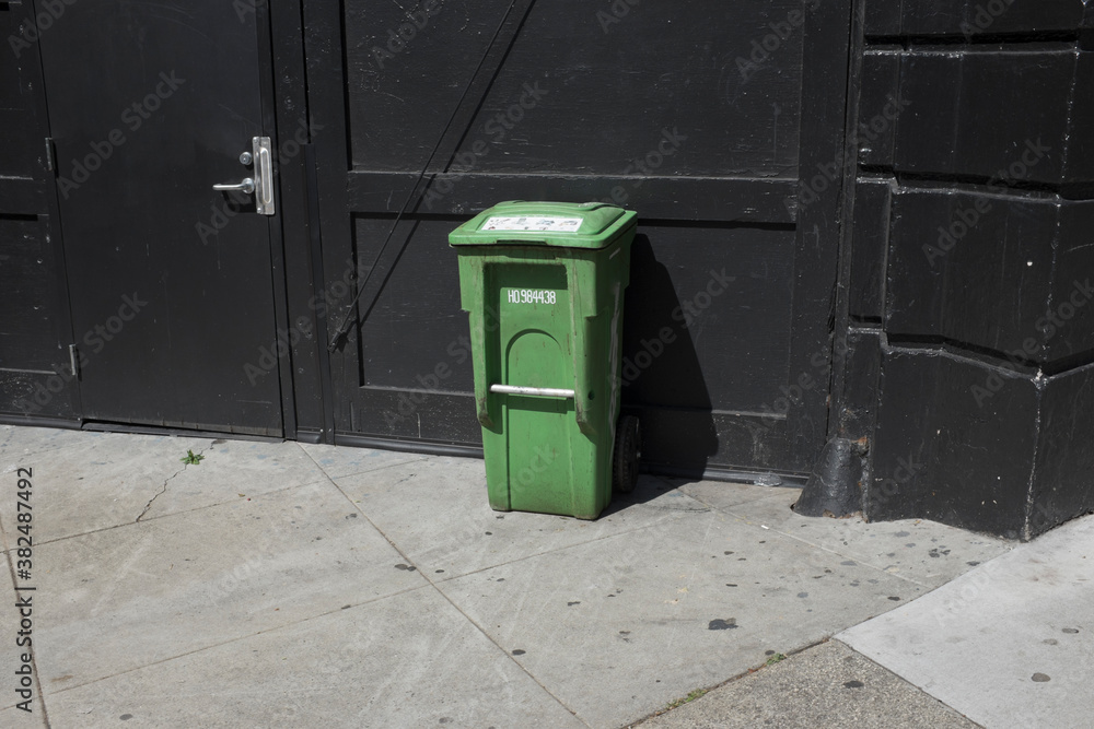 Green Trash Can Stock Photo | Adobe Stock