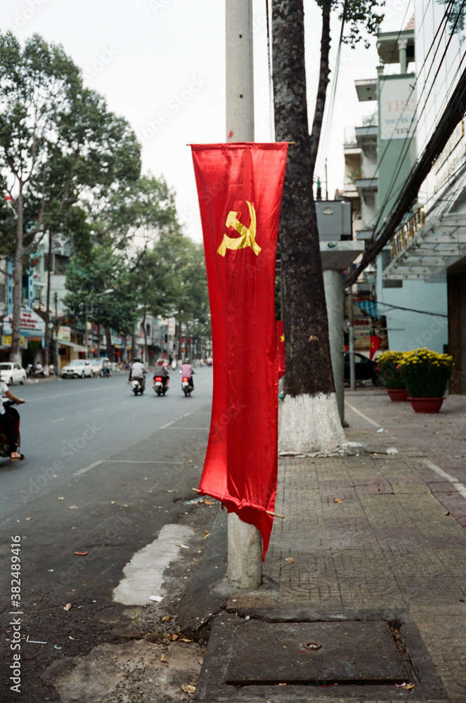 hammer and sickle flag hanging in the street Stock Photo | Adobe Stock