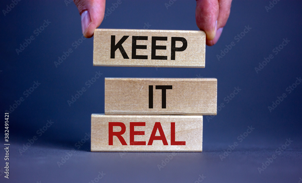 Male hand placing a blocks with word 'keep' on top of a blocks tower ...