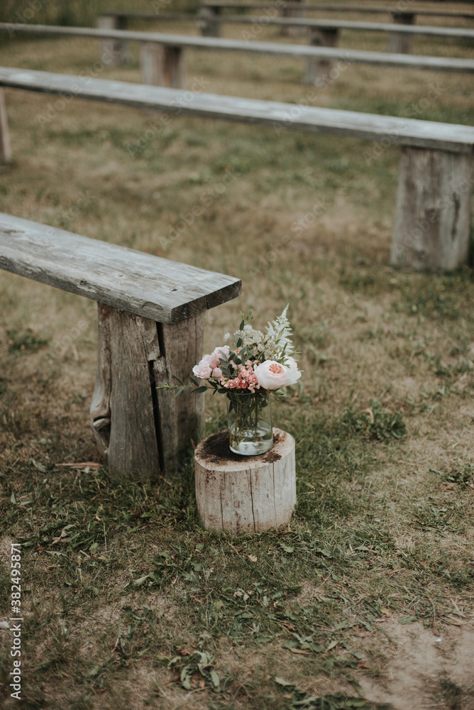 Simple outdoor wedding with wood stump benches for seating and simple ...