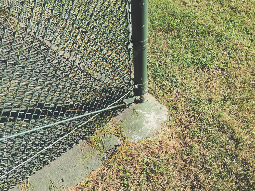 Detail of chain-link fence corner and lawn Stock Photo | Adobe Stock