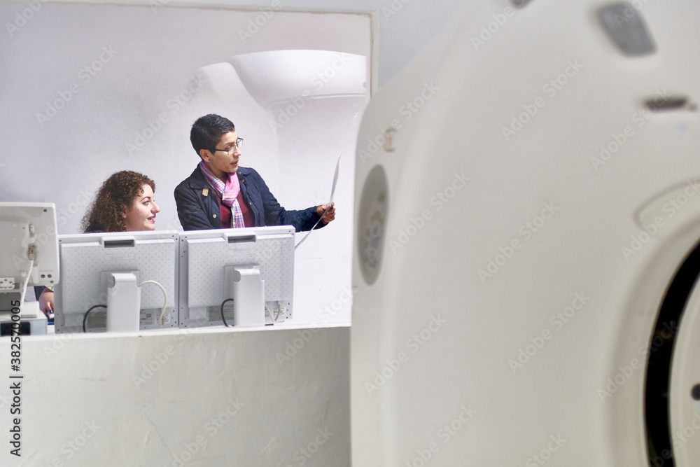 Medical staff investigating results of CT-scan X-ray Stock Photo ...