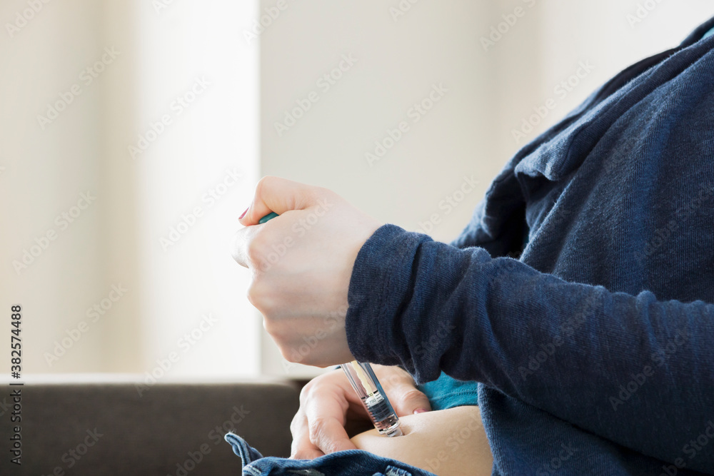 Subcutaneous abdomen injection at home with injection pen Stock Photo ...