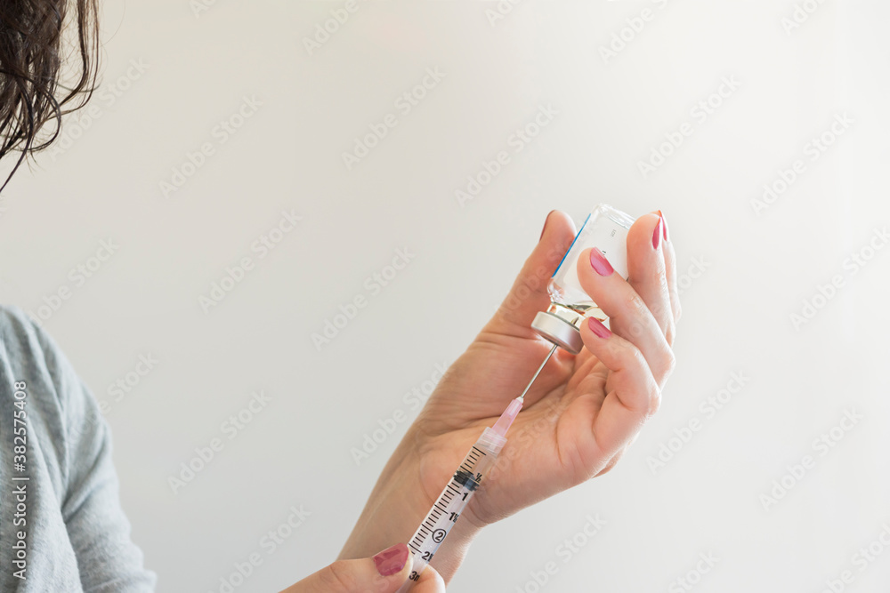 Preparing a syringe for self-injection Stock Photo | Adobe Stock