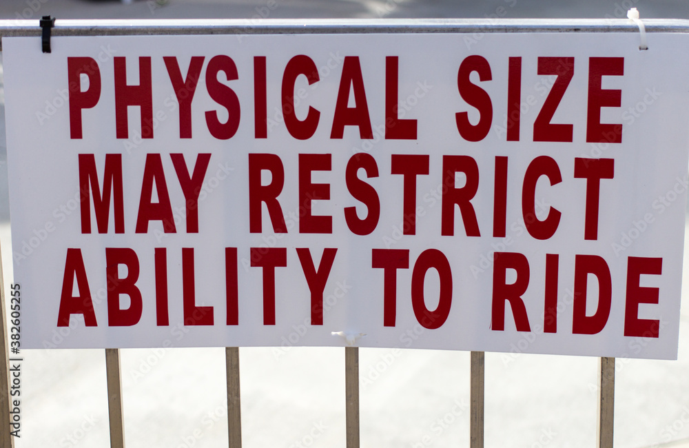 Sign posting restrictions for obese riders at an amusement park on ...