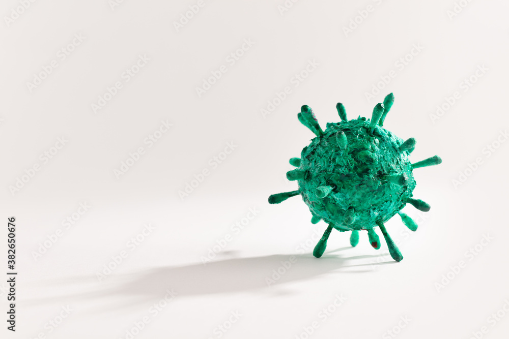 A photograph of a green virus sculpture. The artwork inspired by the ...