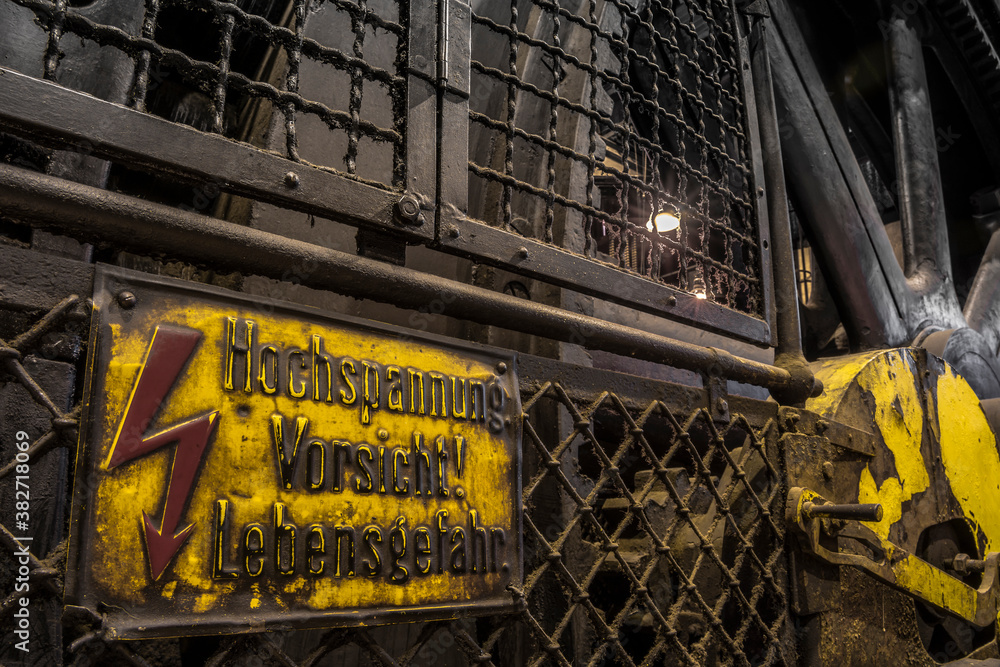 german high tension warning sign on a historic generator Stock Photo ...