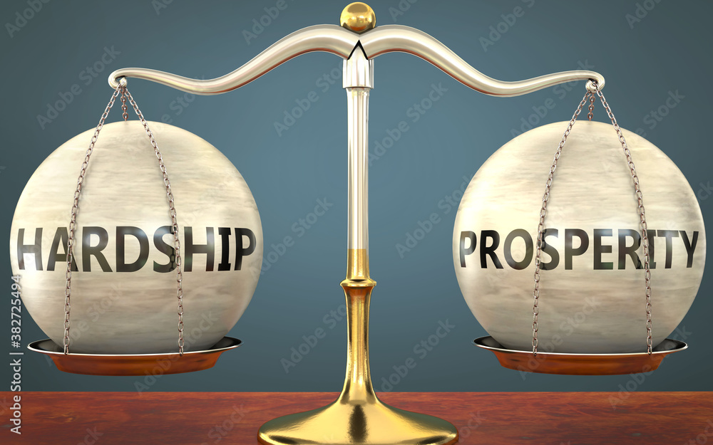 hardship and prosperity staying in balance - pictured as a metal scale ...