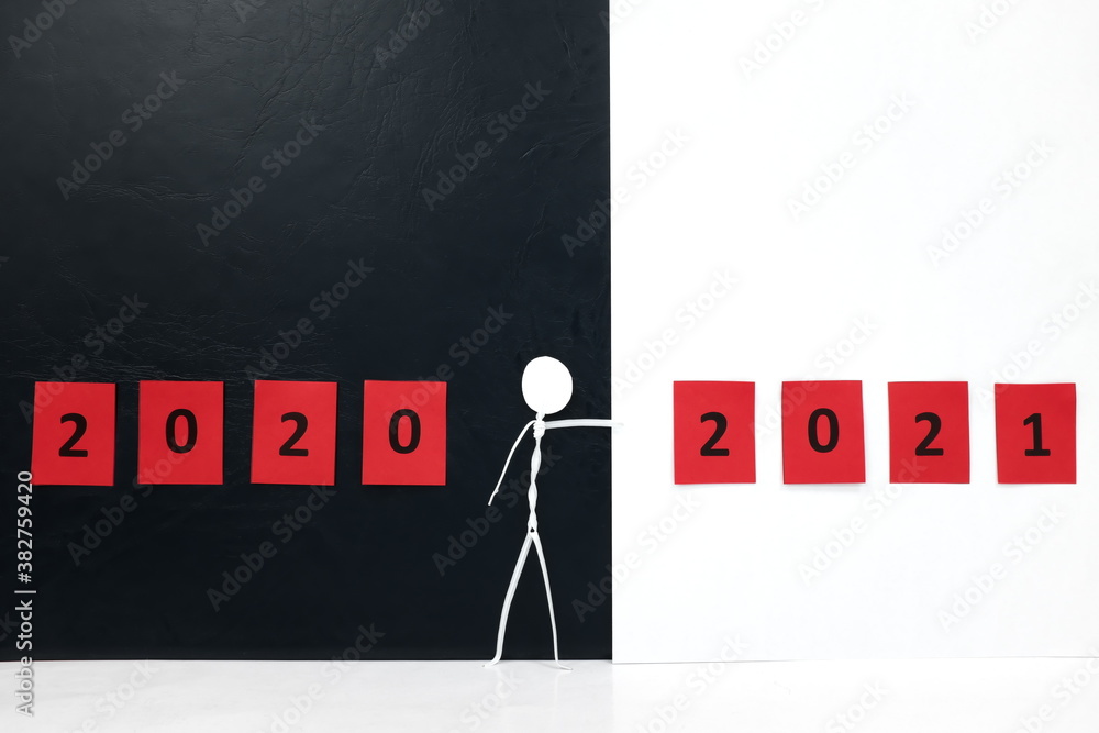 Stick man figure changing 2020 year red poster to 2021 in black ...