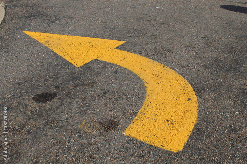 yellow painted parking lot turn arrow to guide automobile drivers Stock ...