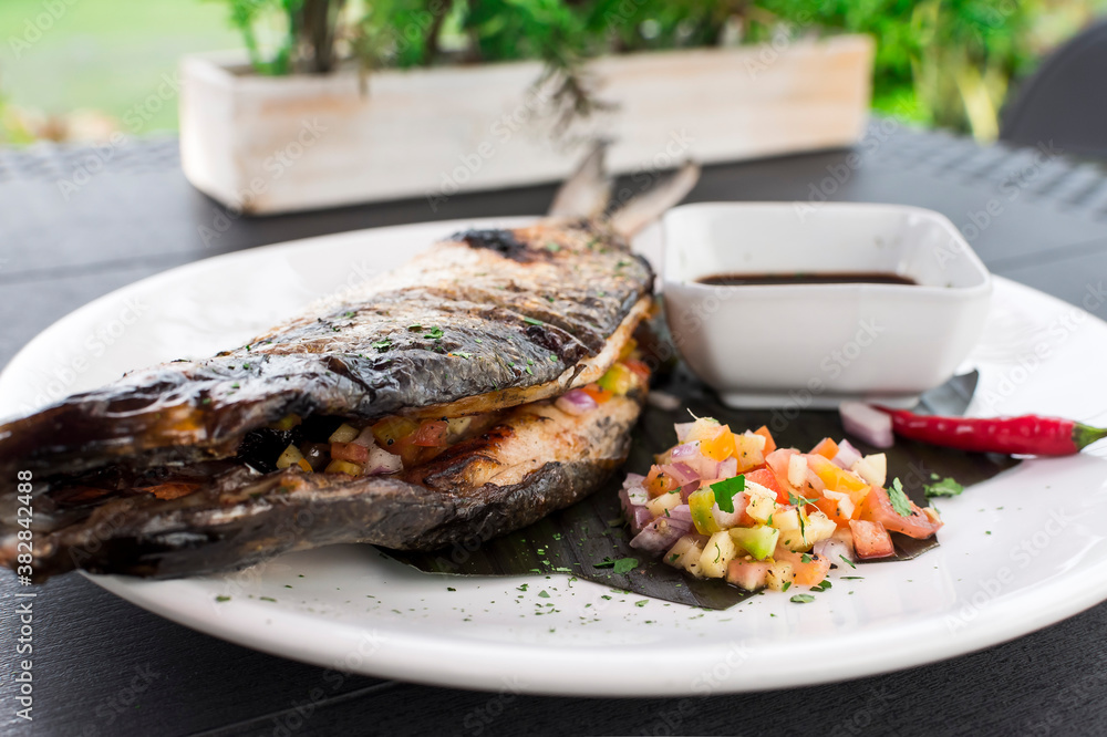 Grilled Boneless Bangus stuffed with vegetables and served with ...