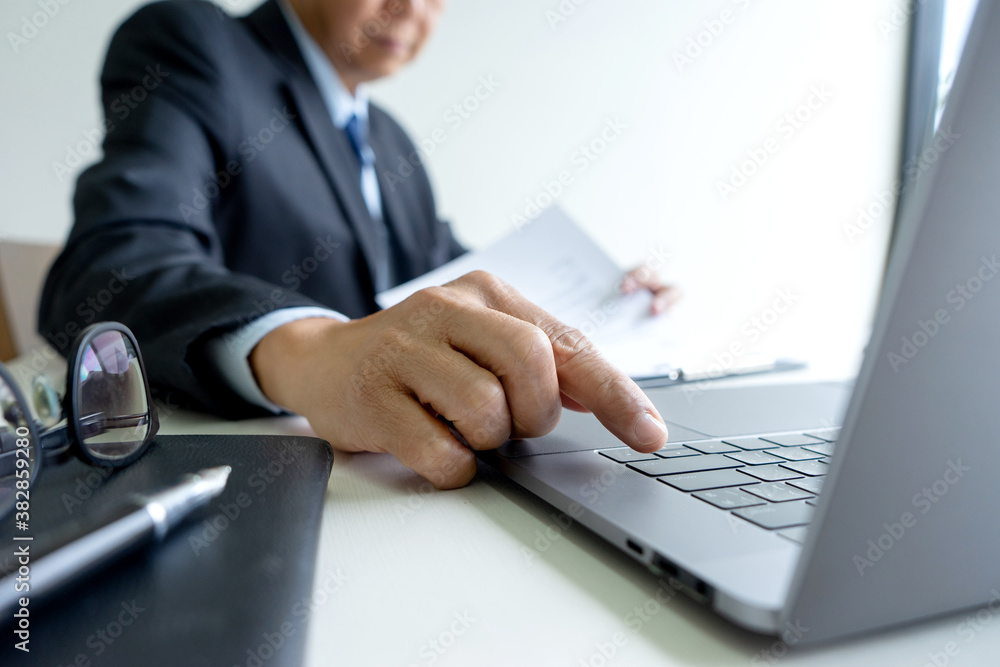 A businessman is pressing a finger on a computer keyboard Stock Photo ...