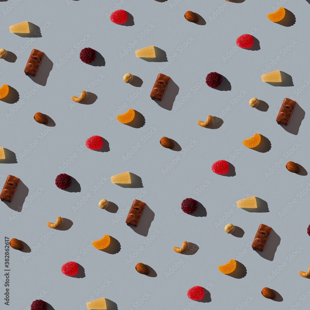 Seamless background with marmalade, various nuts and chocolate on a ...