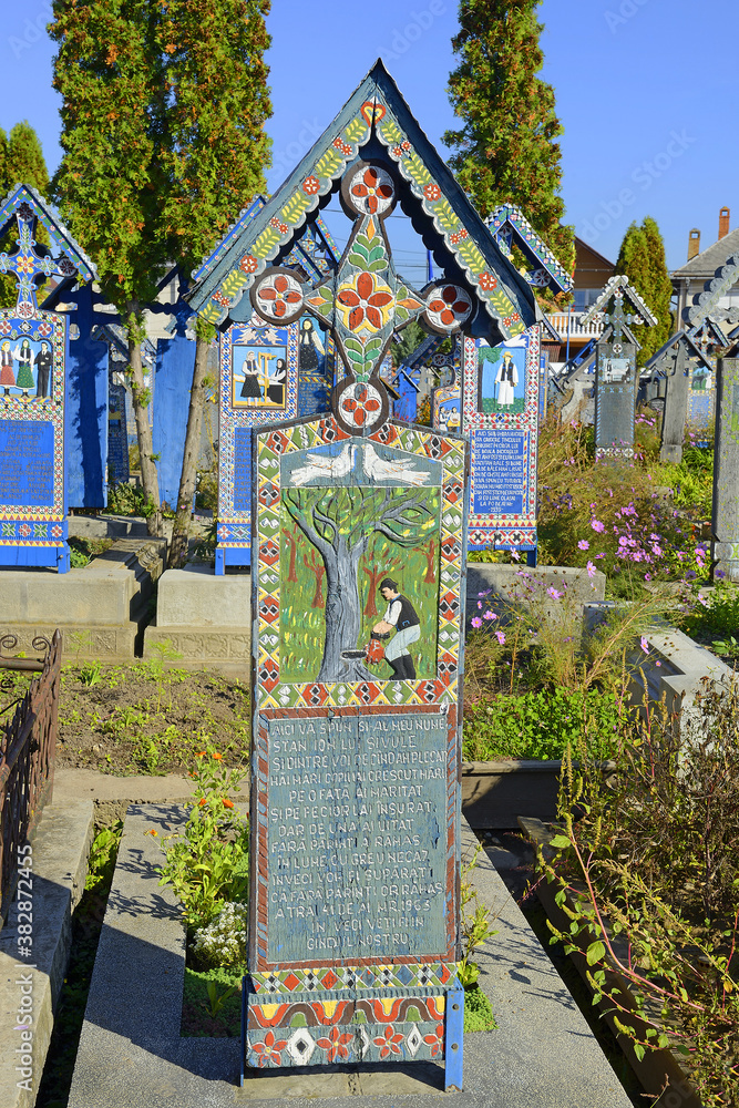 Carved and painted wooden crosses in the Merry Cemetery is visited by ...