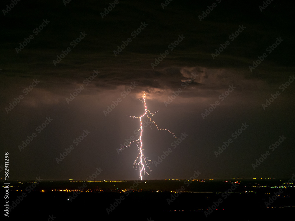 Eerie scenery of lightning strike hitting a town in a dark night Stock ...