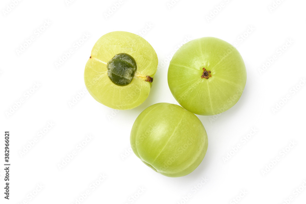 Flat lay (top view) of Fresh Indian gooseberry fruits with cut in half ...