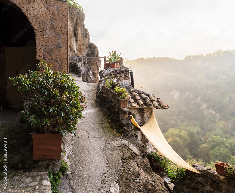 Valley view in the mist from the mountainous street in the medieval ...