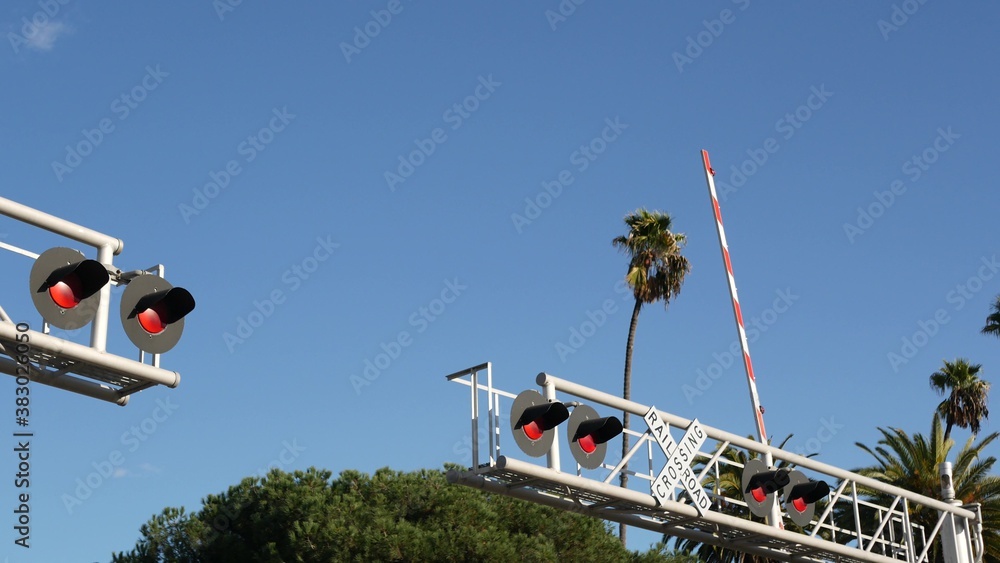 Level crossing warning signal in USA. Crossbuck notice and red traffic ...
