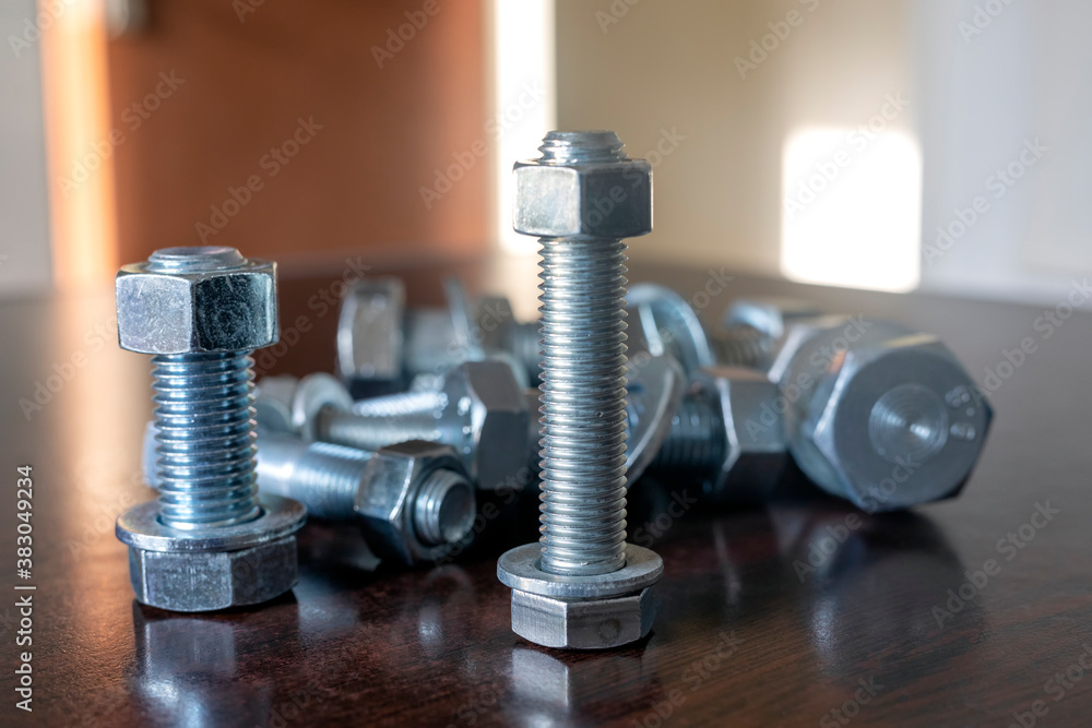 A lot of metal bolts, nuts and washers. Bolts are for the assembly of ...