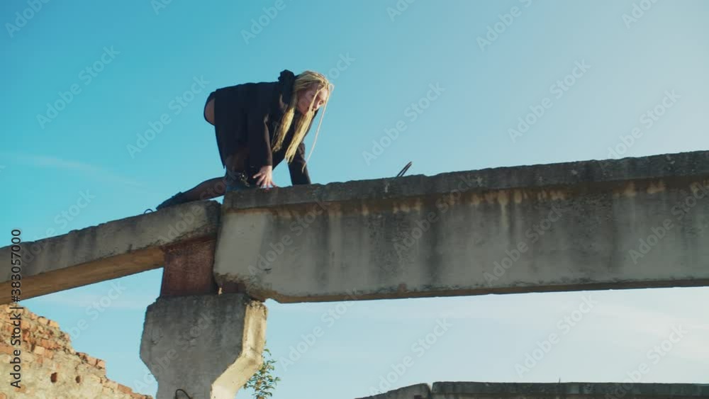 Scary creepy female vampire climbing up ruins of abandoned building ...