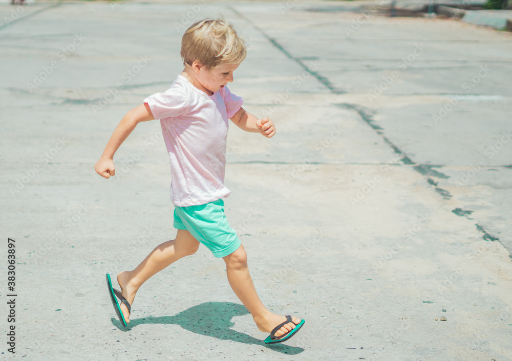 Smiling freckled blond boy autistic facial expressions, run marching ...