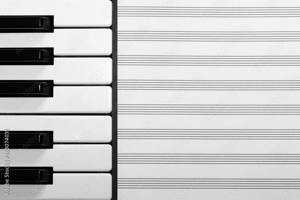 Empty musical sheet with piano keyboard from the left side, black and ...