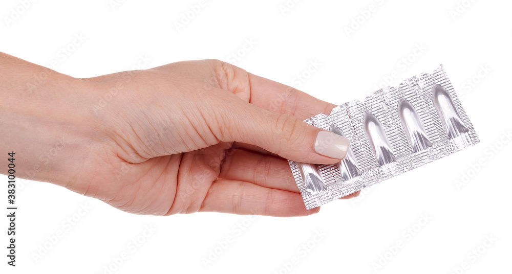 Hand with Blister with rectal suppository. Isolated on white background ...