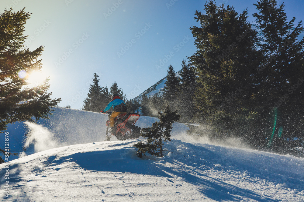 Snowbike rider in mountain valley in beautiful snow powder. Snowdirt ...