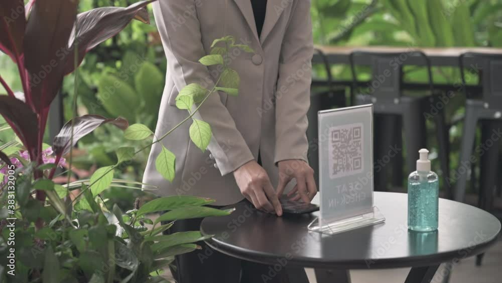 Close up woman scan check-in QR code by smartphone app and cleansing ...