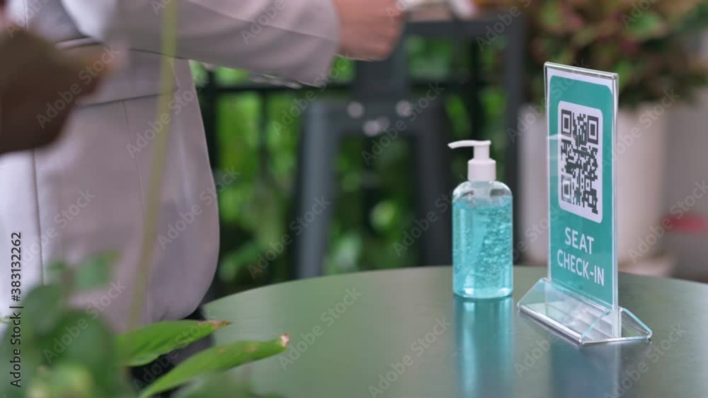 Close up woman scan check-in QR code by smartphone app and cleansing ...