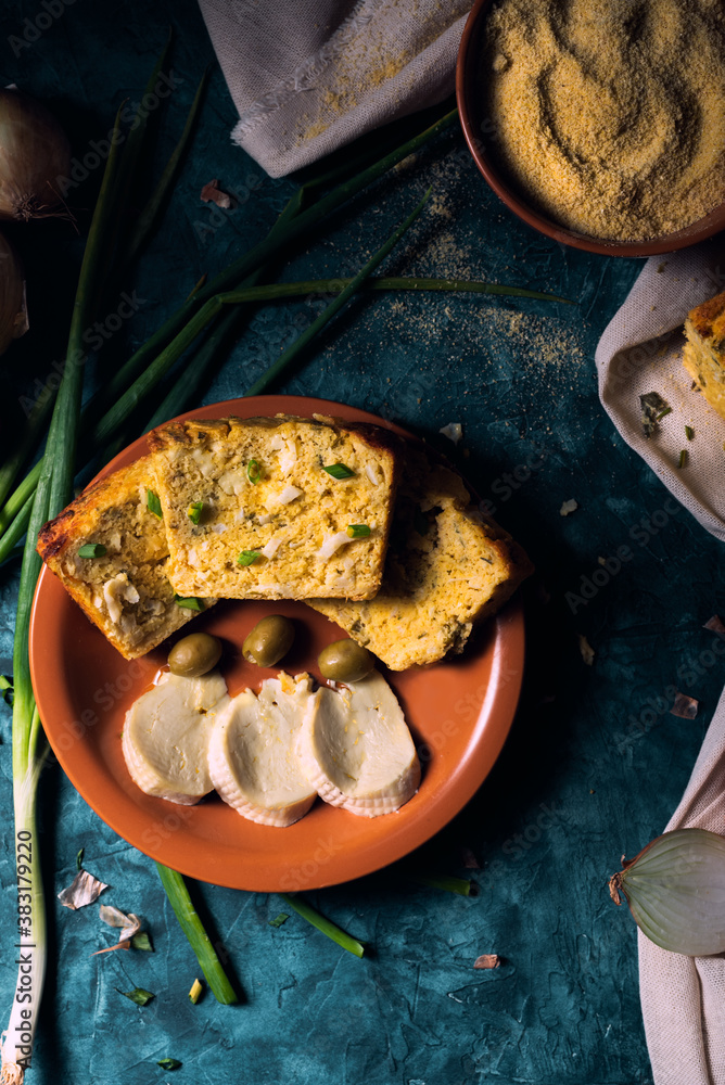 Traditional paraguayan food known as sopa paraguaya on a brown ceramic ...