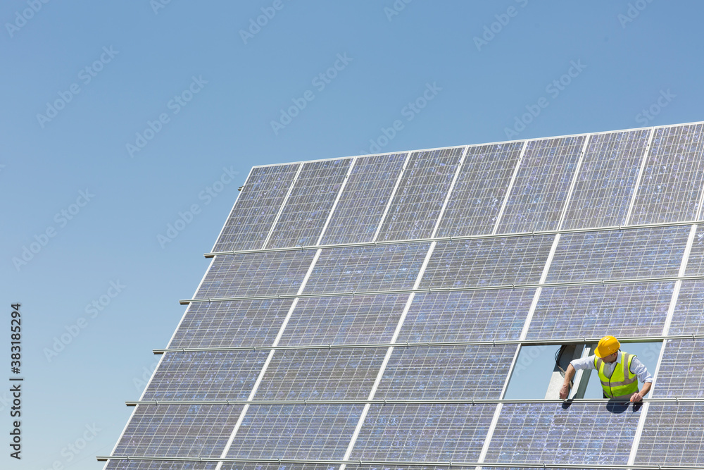 Engineer fixing solar panels Stock Photo | Adobe Stock