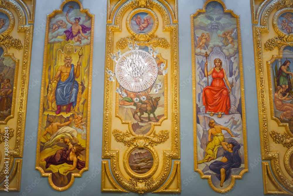 This opulent image shows a gilded ceiling mural artwork of greek gods ...
