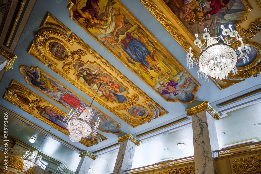 This image shows opulent, gilded antique ceiling artwork of greek gods ...