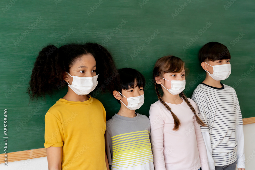 Group of diverse elementary students in classroom. Primary school multi ...