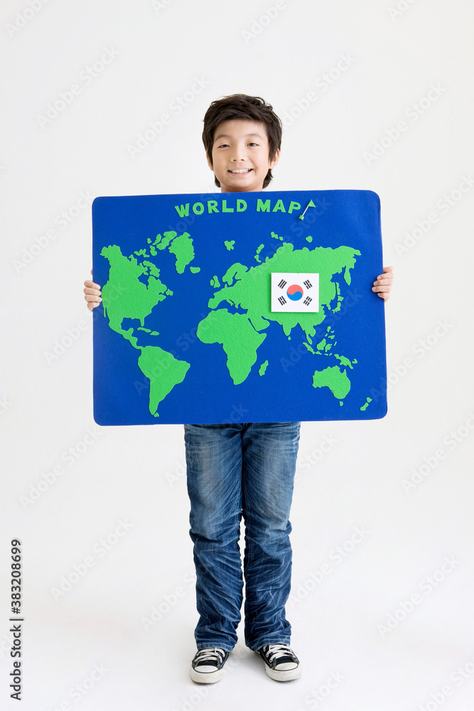 boy holding map of the world Stock Photo | Adobe Stock