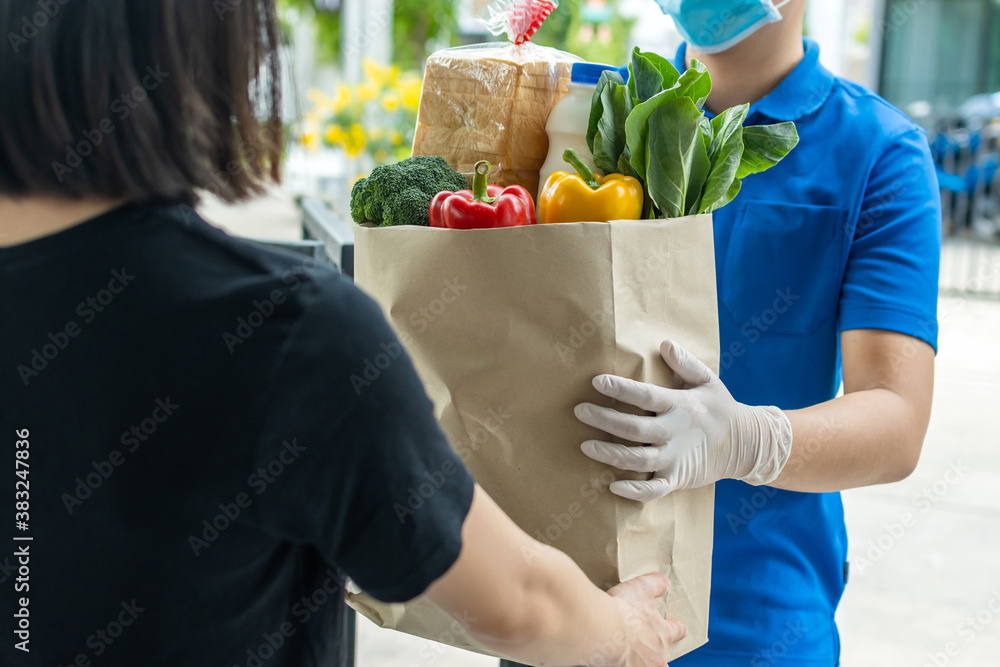 hand of food delivery service man wearing protection face mask holding ...