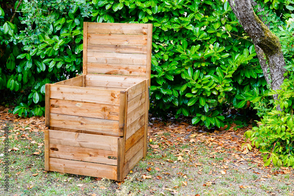 Worm composting wooden composter box in home garden Stock Photo | Adobe ...