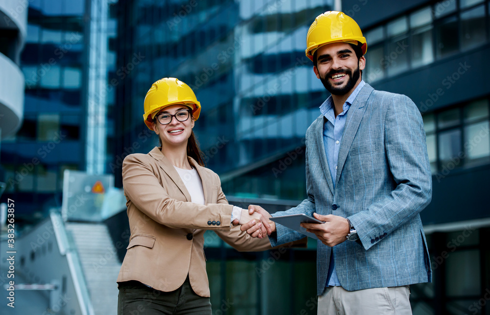 Foto de Good job. Construction engineers checking building site ...