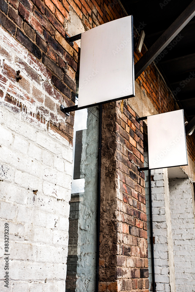 Blank white sign boards on exterior of brick building Stock Photo ...
