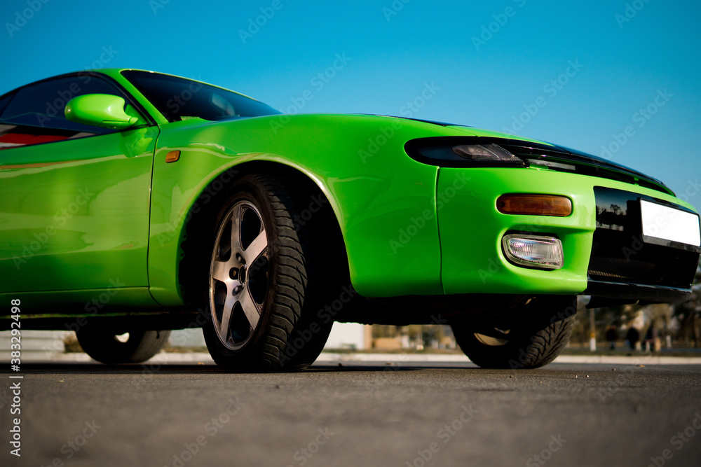 Green and black sport coupe car with big wheels. Japanese oldtimer ...