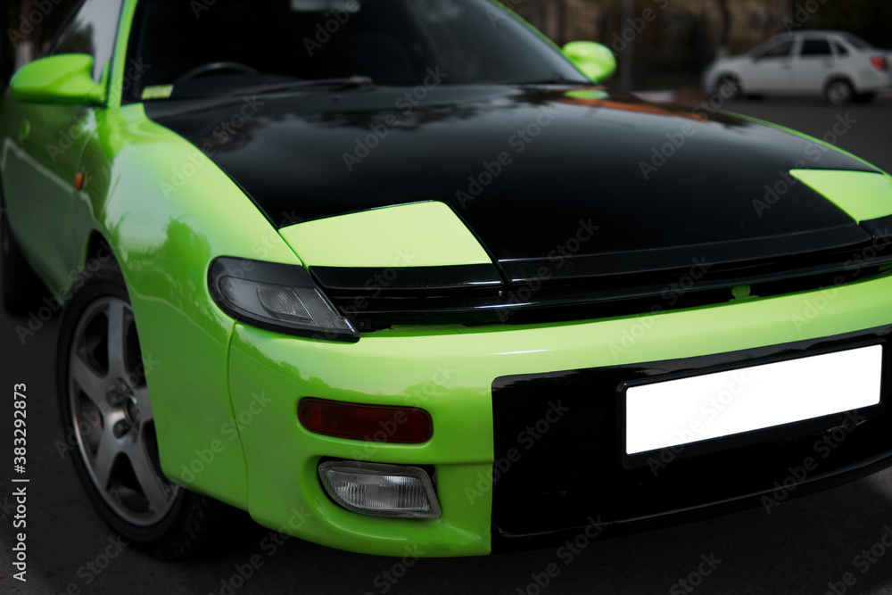 Green and black sport coupe car with big wheels. Japanese oldtimer ...