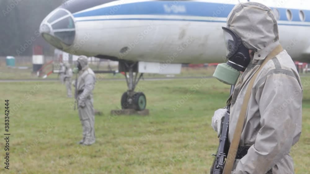 People in a suit that protects against biological weapons and ...