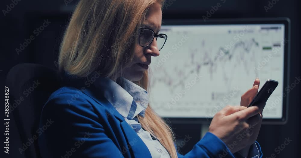 Side view of concentrated business lady with blond hair using modern ...