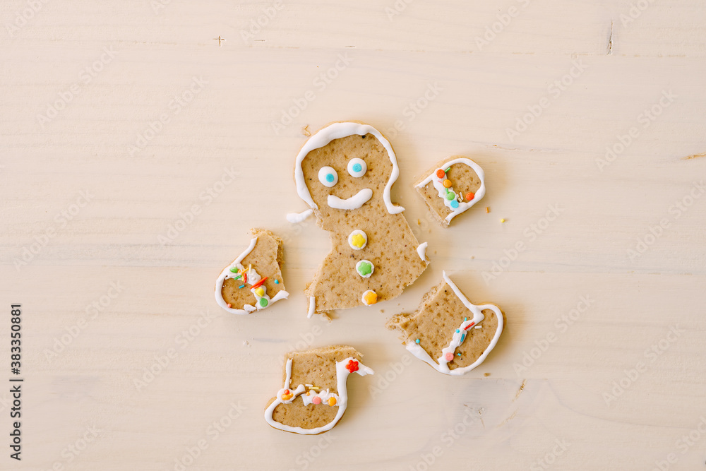 Gingerbread man with severed legs and arms. The limbs of the cookie are ...