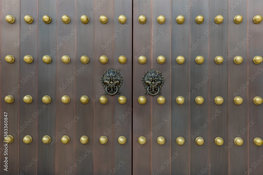 The door and knockers of Chinese temple. Ancient Asian door from temple ...