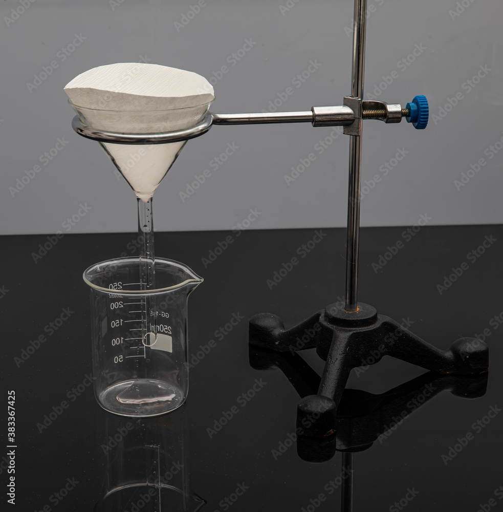 Filter paper in laboratory. Scientists are chemical filtration by ...